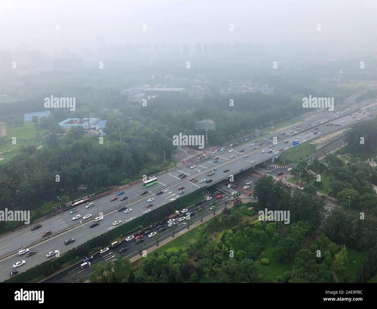 Top view highway with severe air pollution, fog and haze in Beijing ...