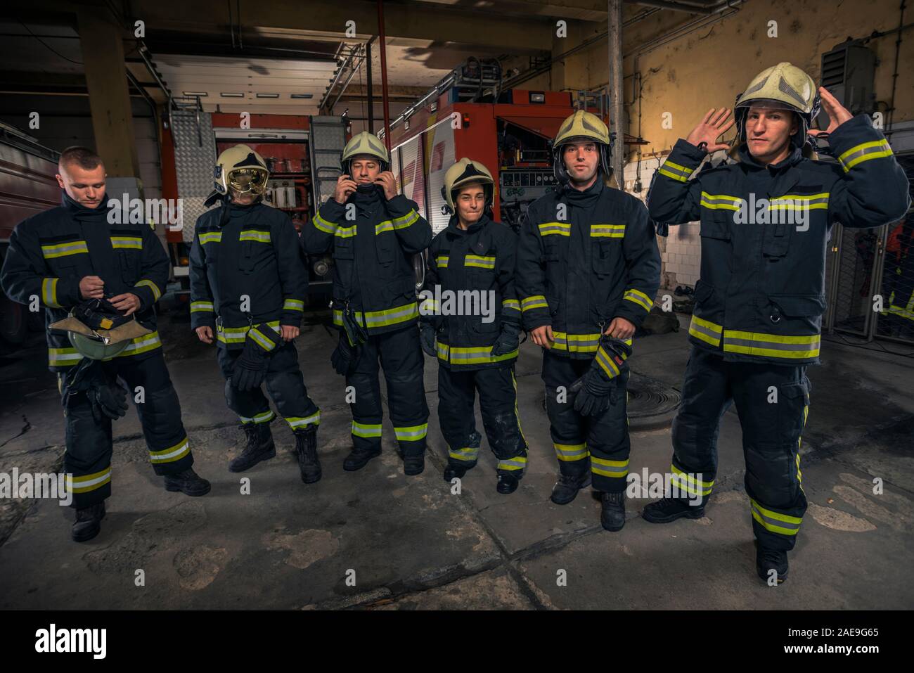 Firewoman standing fire engine hi-res stock photography and images - Alamy