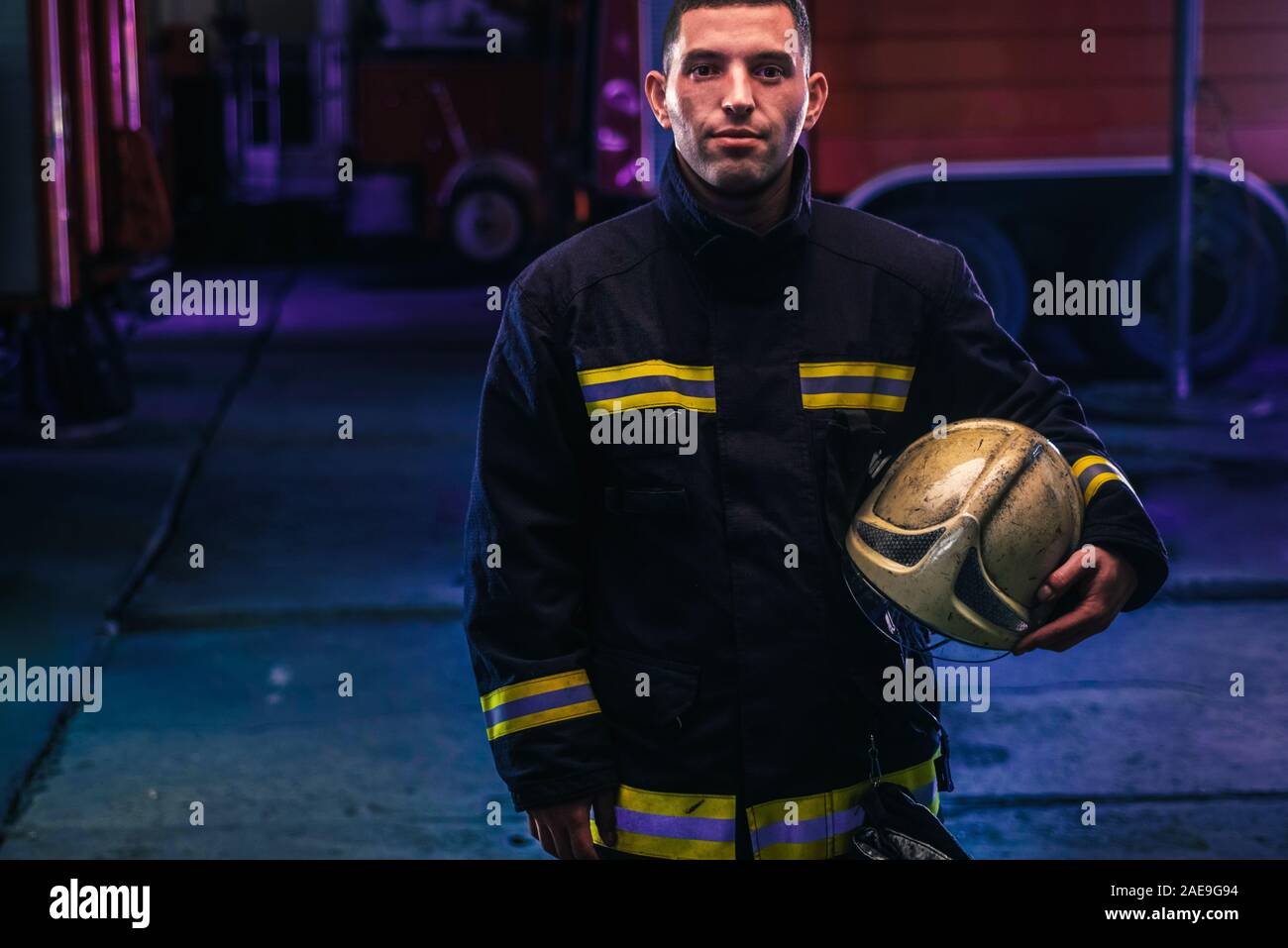 Portrait of a firefighter with uniform inside the fire station Stock ...
