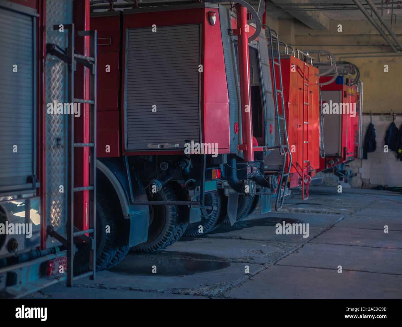 Fire engines parked inside the garage of the fire brigade Stock Photo ...