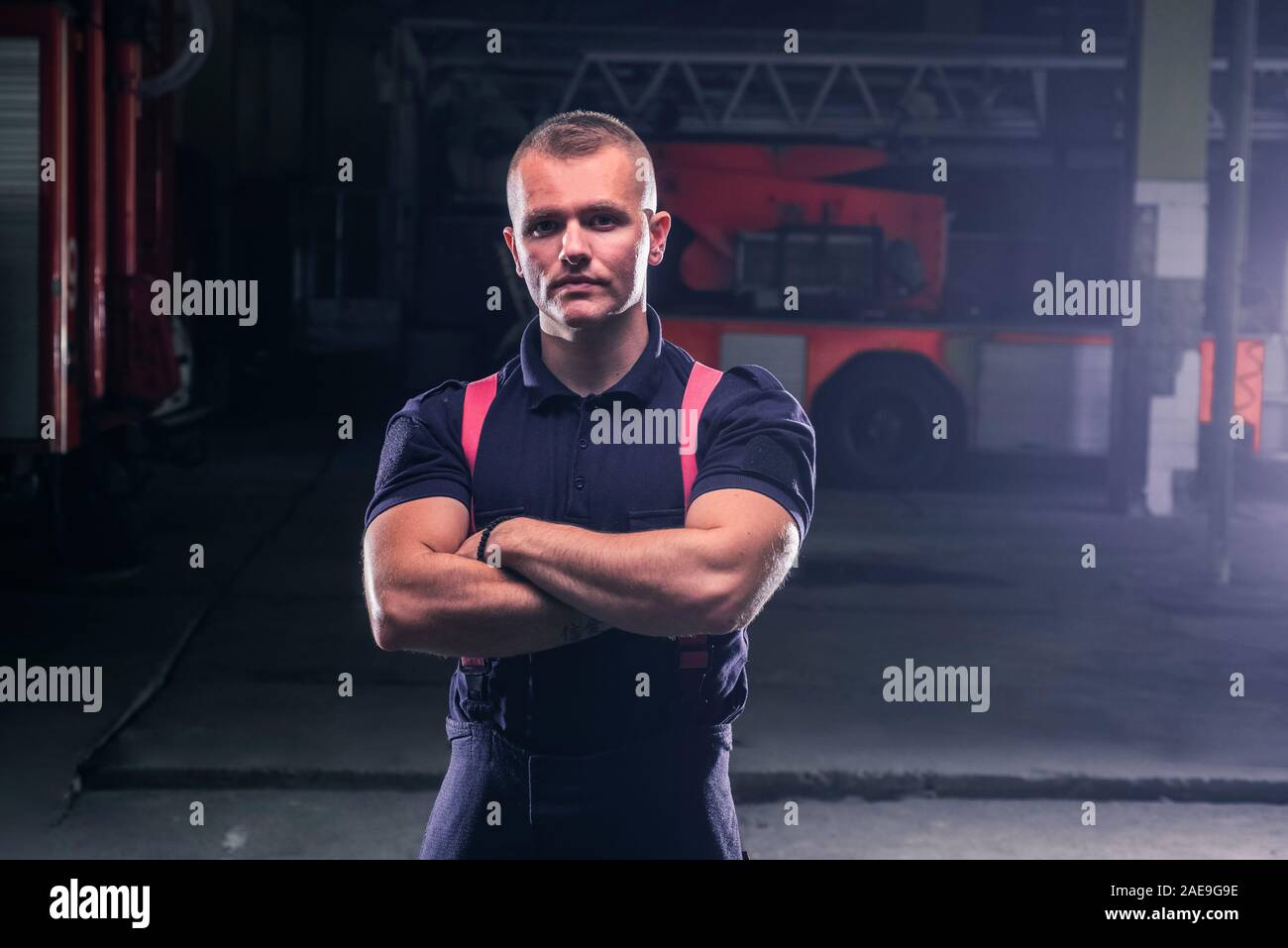 Portrait of a firefighter with uniform inside the fire station Stock ...