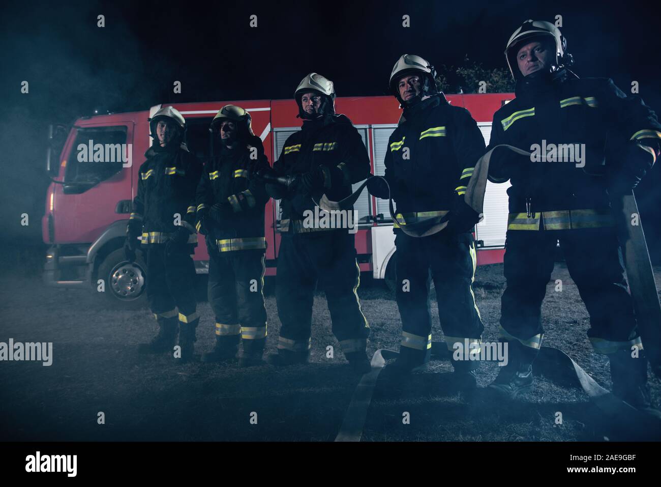 Fire brigade during operation in the field at night time Stock Photo ...