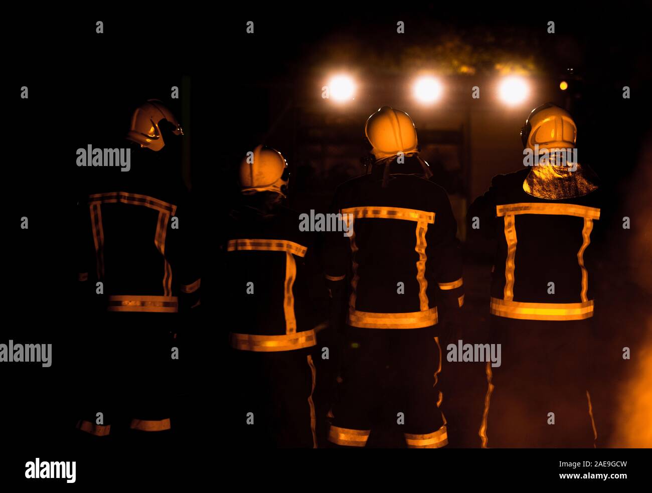 Firemen getting ready during a firefighting intervention Stock Photo ...