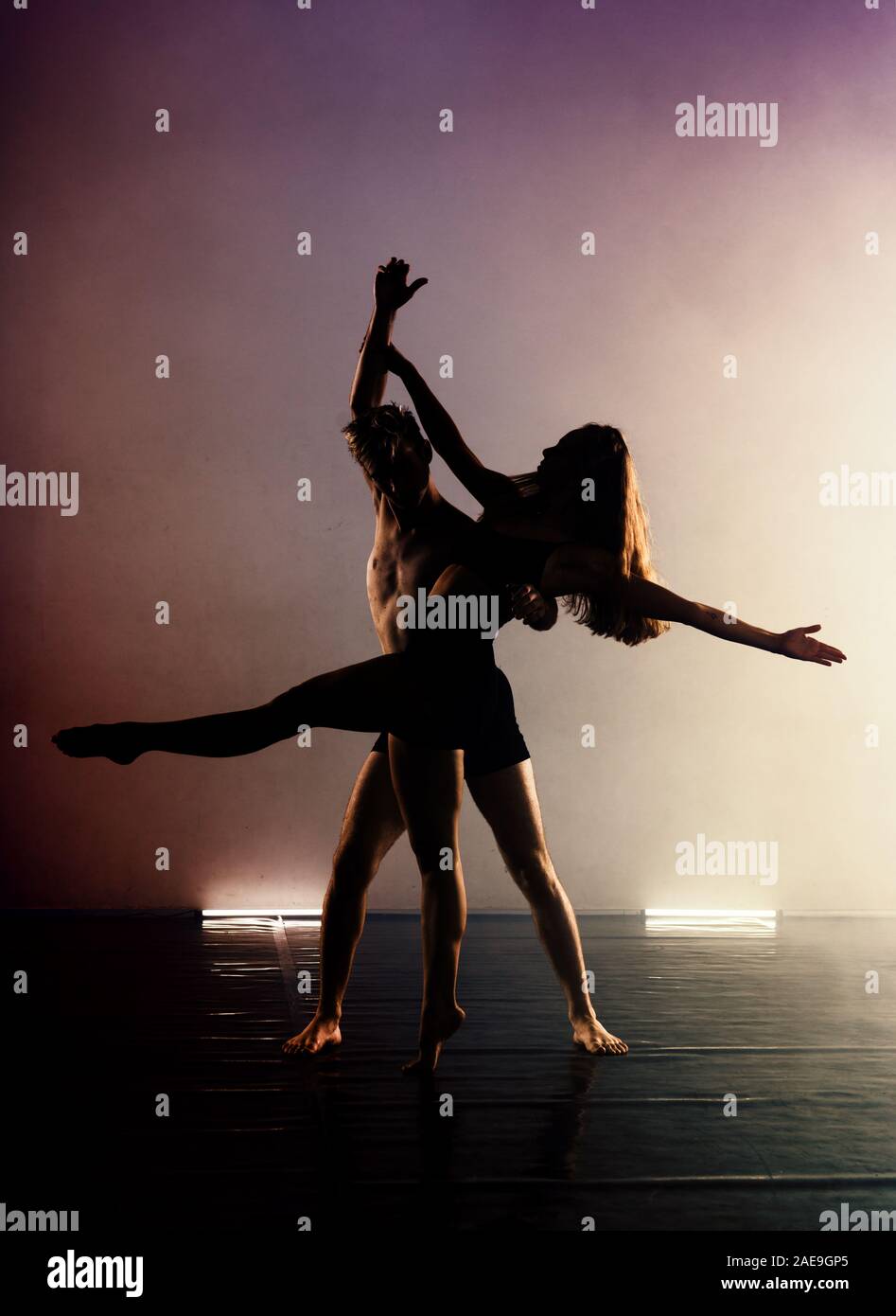 Couple Of Silhouette Contemporary Dancers Practicing A Dance Routine