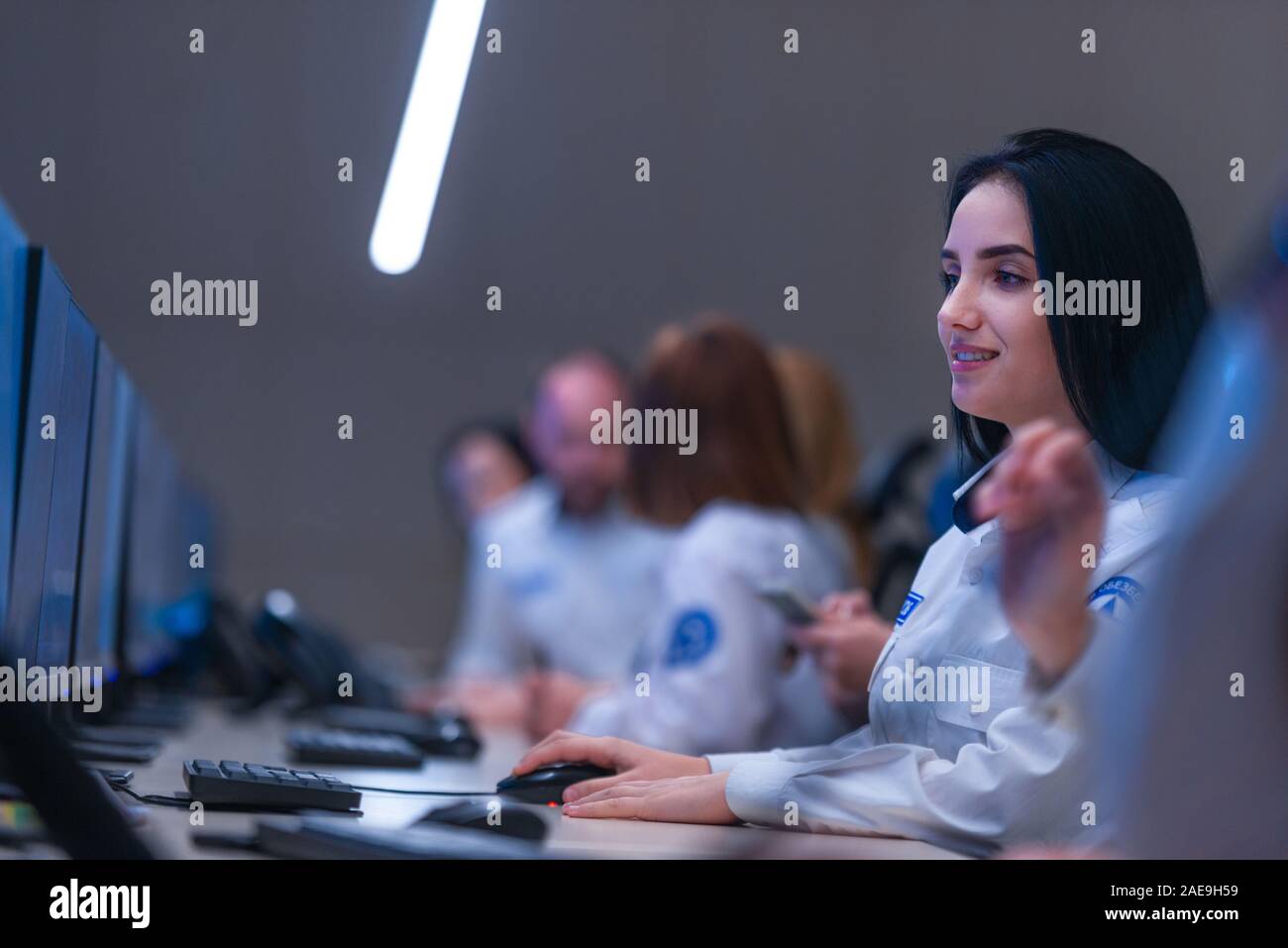 Technical Operator Works at His Workstation with Multiple Displays ...