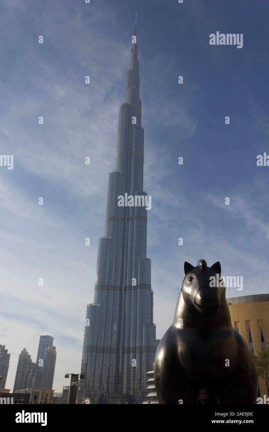 DUBAI, UAE - DECEMBER 26 2017: Horse of Botero in front of Burj Khalifa ...