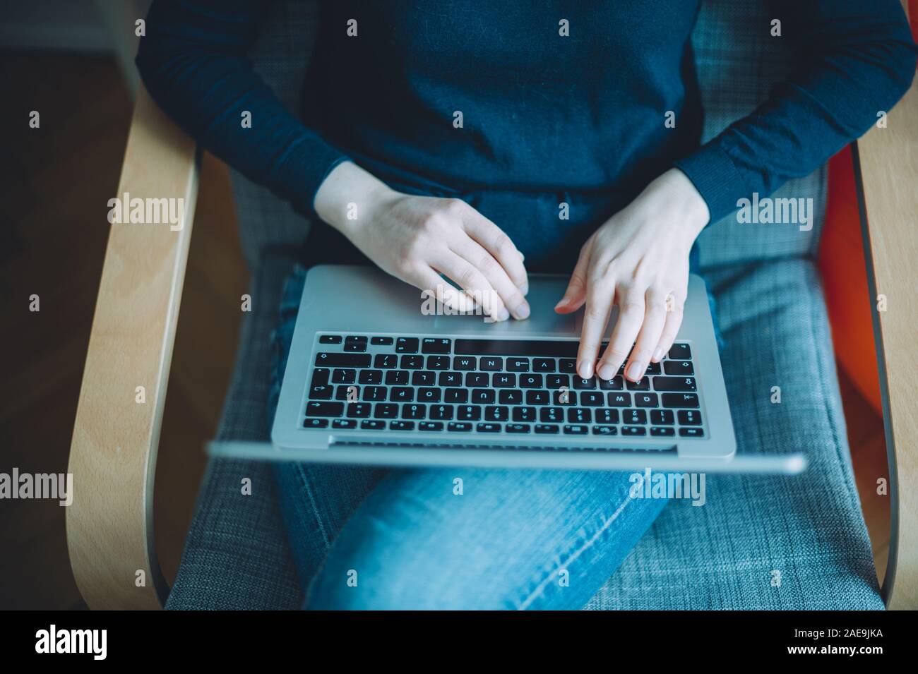 Overhead view of female hand working coding on new aluminum laptop ...