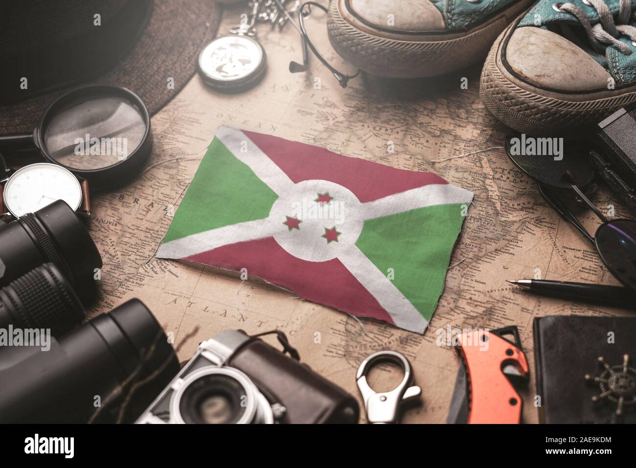 Burundi Flag Between Traveler's Accessories on Old Vintage Map. Tourist ...