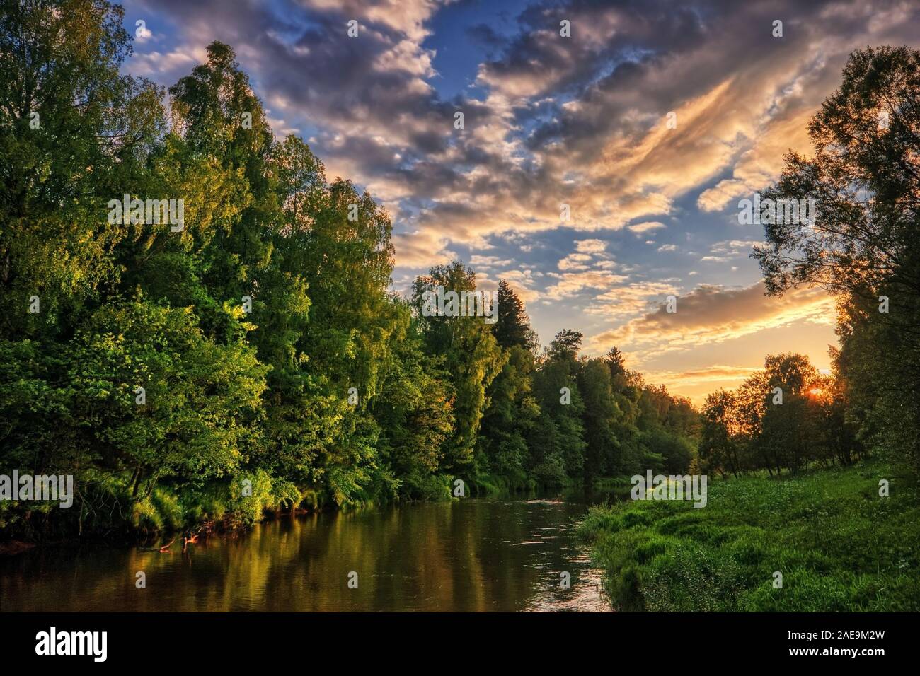 Summer river in sunset light Stock Photo - Alamy