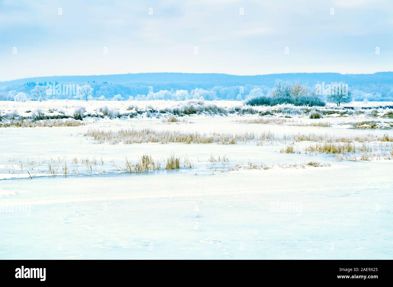winter landscape of lake covered with ice Stock Photo - Alamy