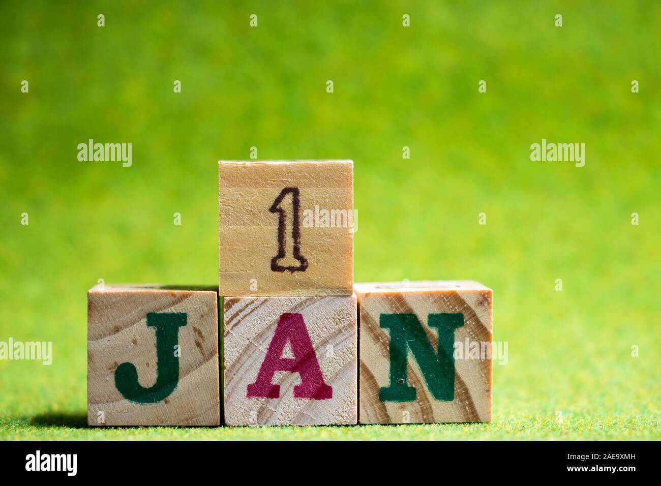Letter block in word 1jan on artificial green background (Concept for ...