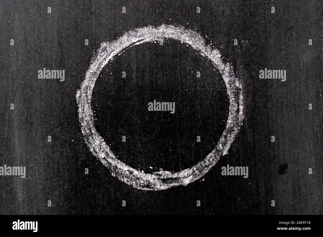 White chalk hand drawing in circle or round shape on black board ...