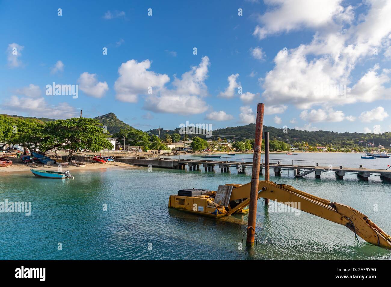 Dredging, pontoon excavator sunk in harbor in Carriacou, Grenada Stock ...