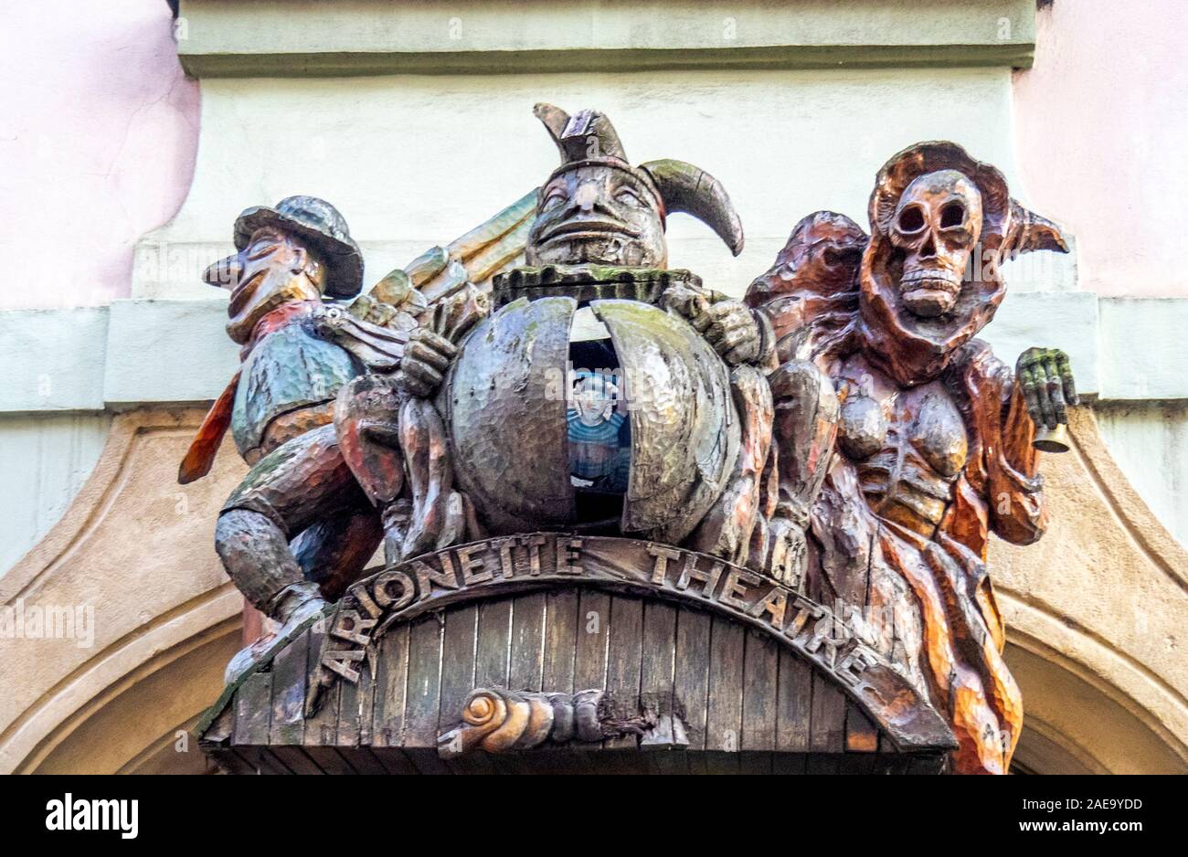Wooden sculpture of grotesque characters over the entrance to ...
