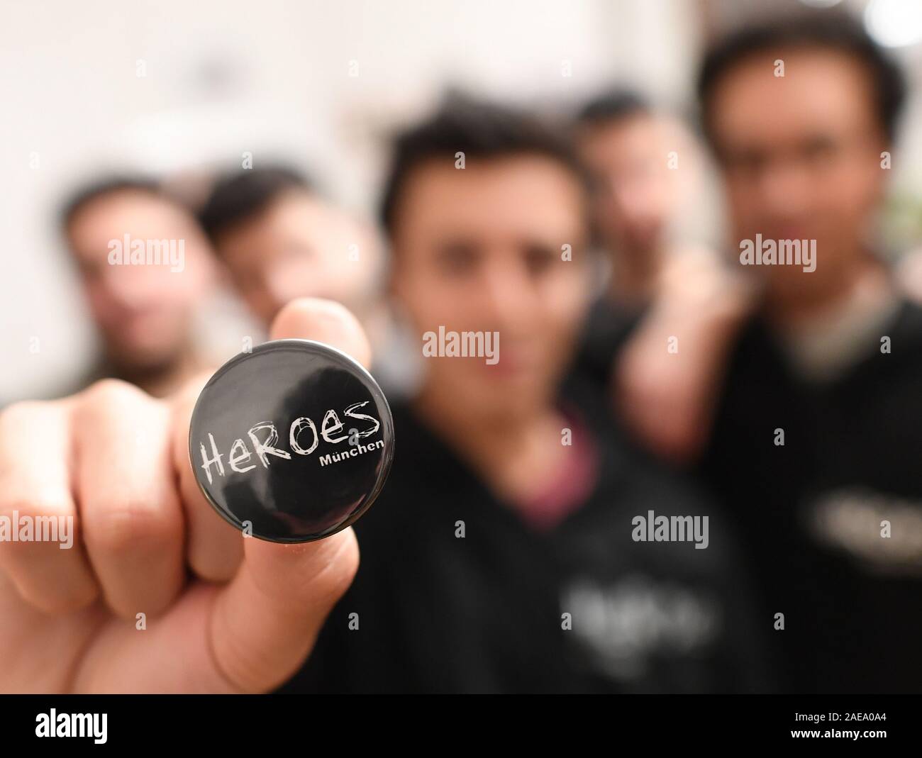 Munich, Germany. 28th Nov, 2019. A member of the "HEROES München" holds ...