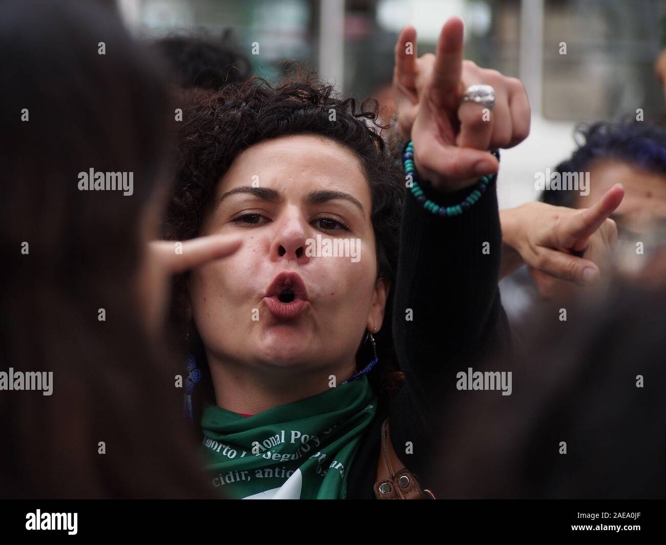 Female demonstrators wearing green handkerchiefs performing in a ...