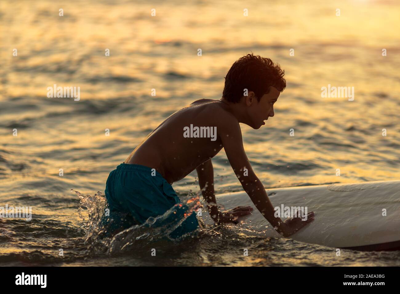 a tired guy with a surf rack in a bathing suit to learn slides on the ...
