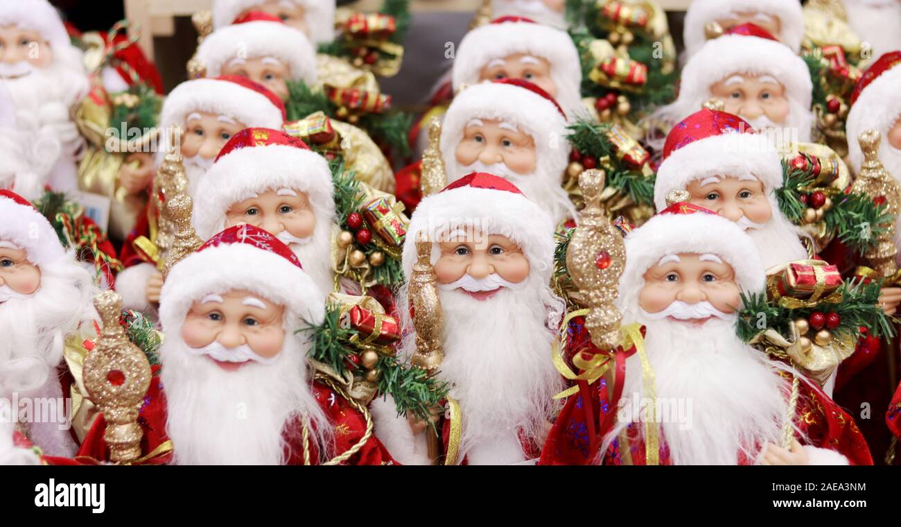 Army of Santa Clauses toy figures in red suits with presents and sticks ...