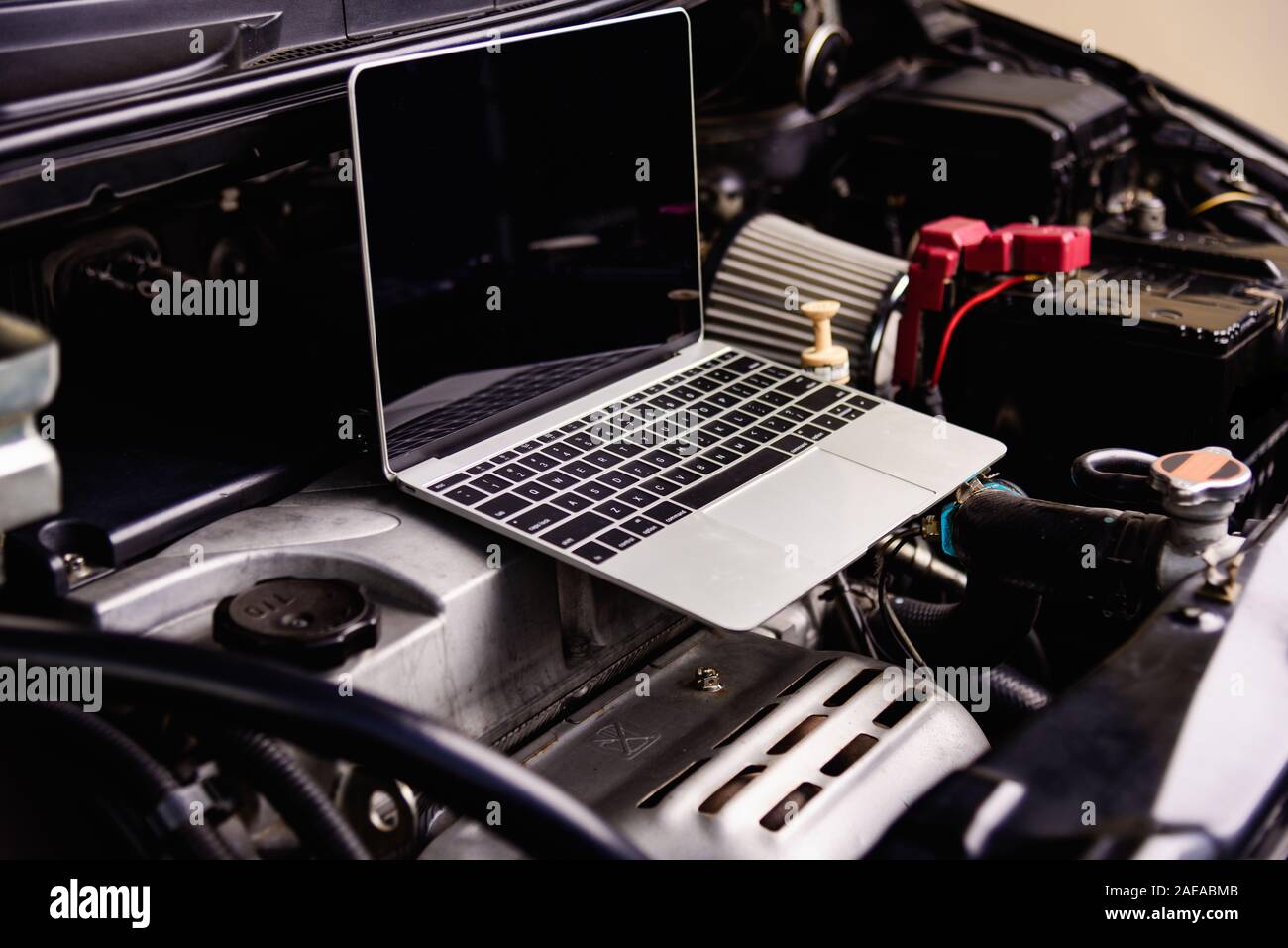 Laptop computer on car mechanic engine for service at workshop Stock ...
