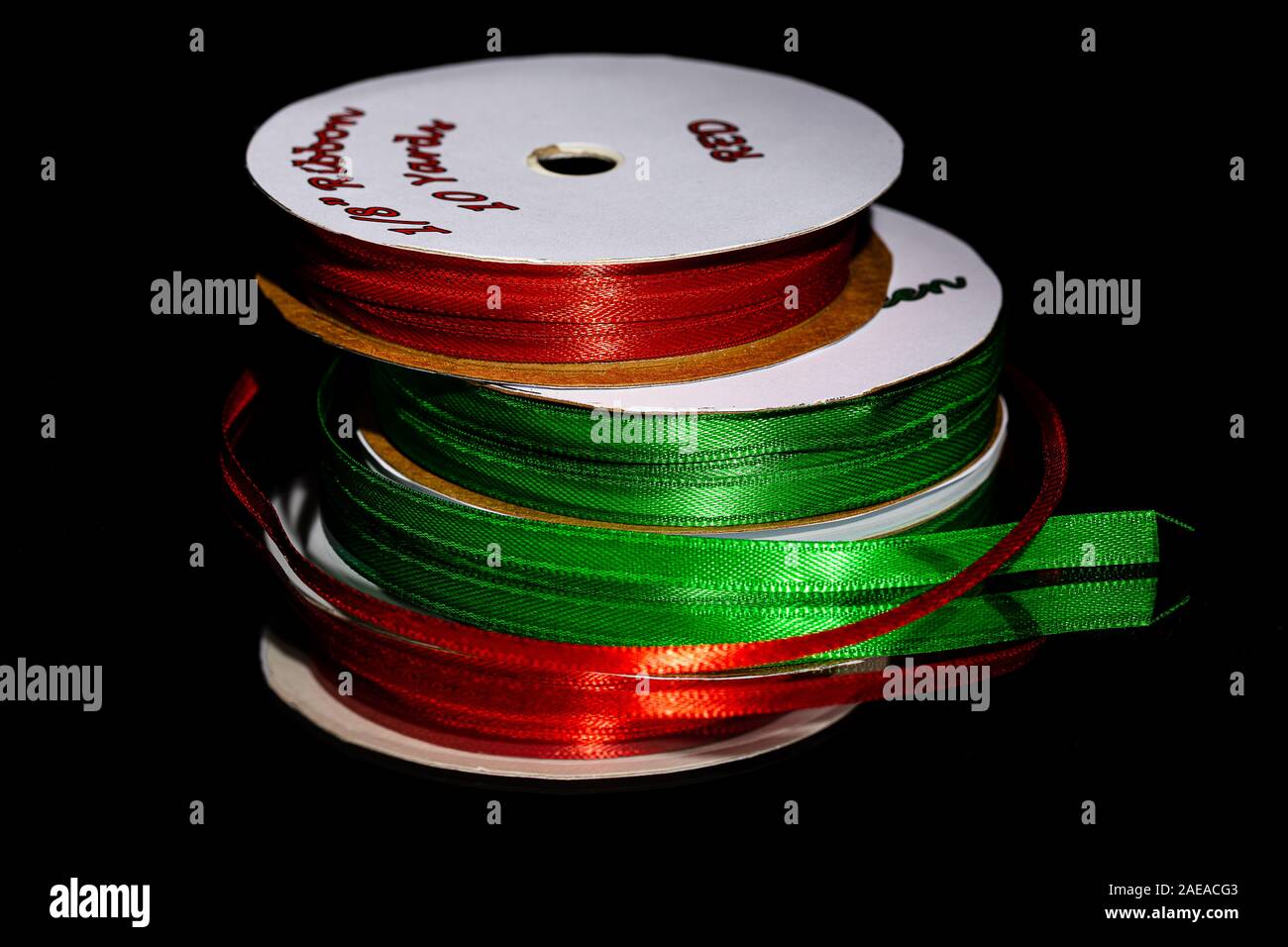 2 spools of ribbon in green and red for the holiday season crafting ...