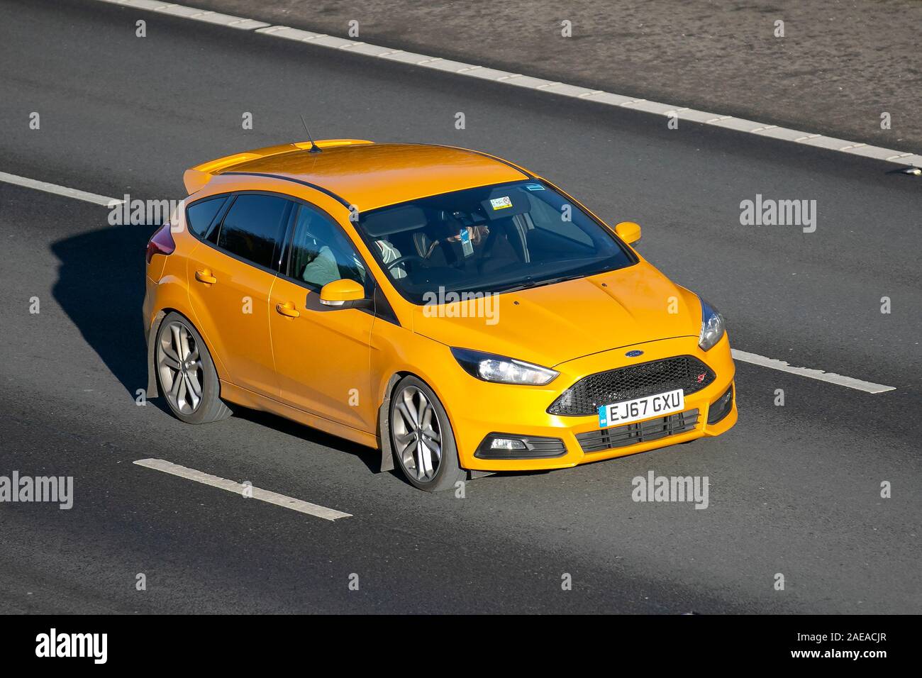 2017 yellow Ford Focus St-2 Turbo; Vehicular traffic, transport, modern ...