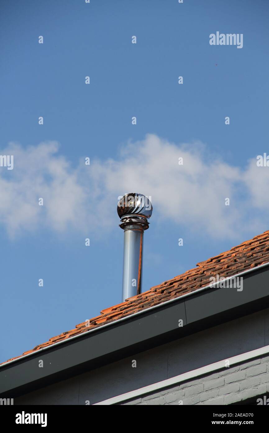 new stainless steel chimney on a house Stock Photo - Alamy