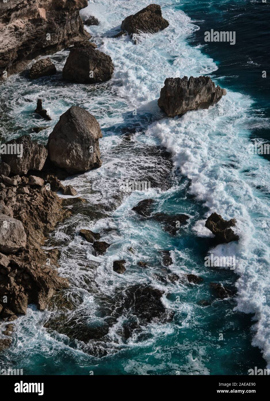 Aerial view to ocean waves with rocks. Blue water background Stock ...
