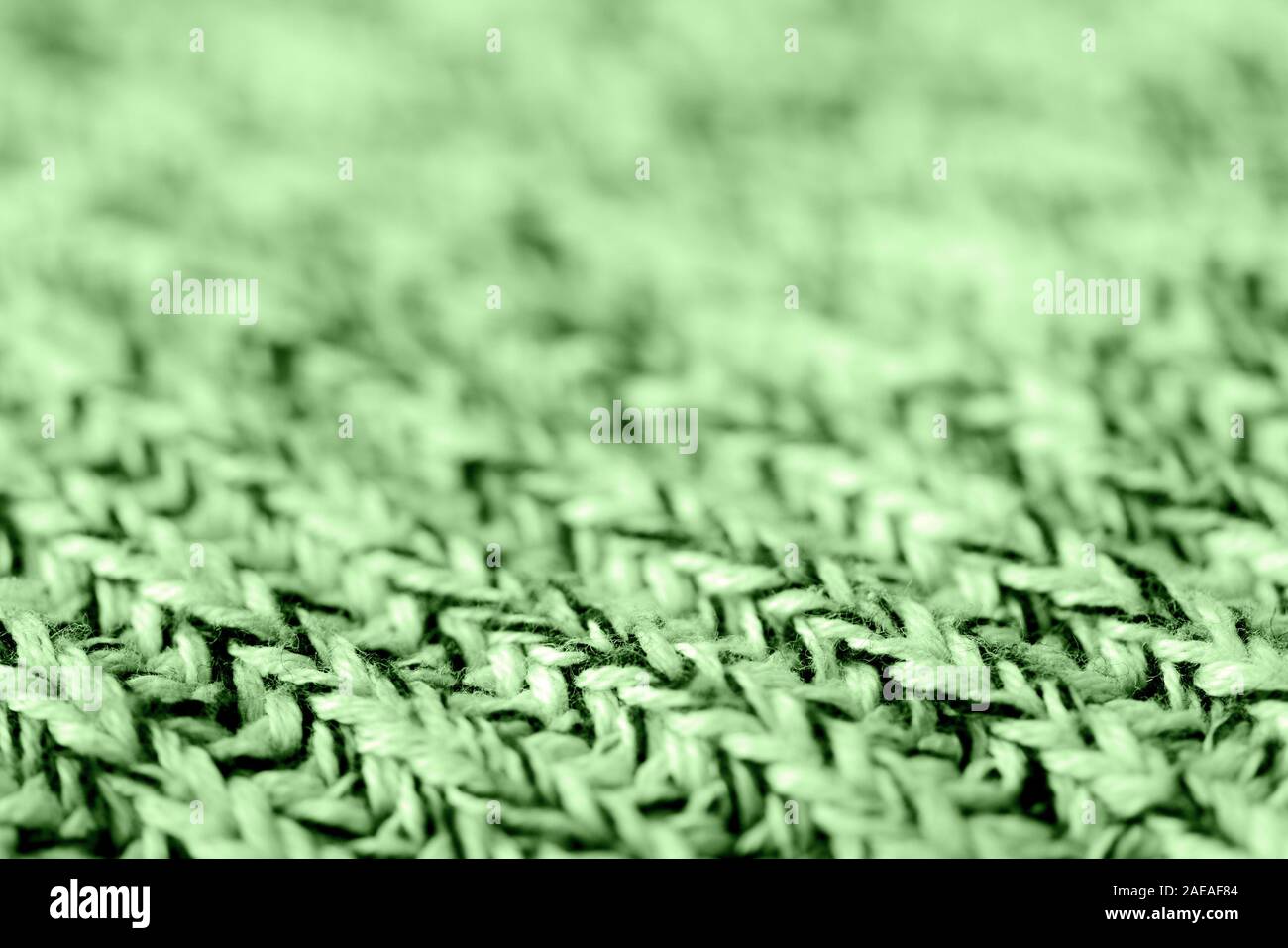 Knitted woolen texture close up. Textile background green color toned Stock Photo - Alamy
