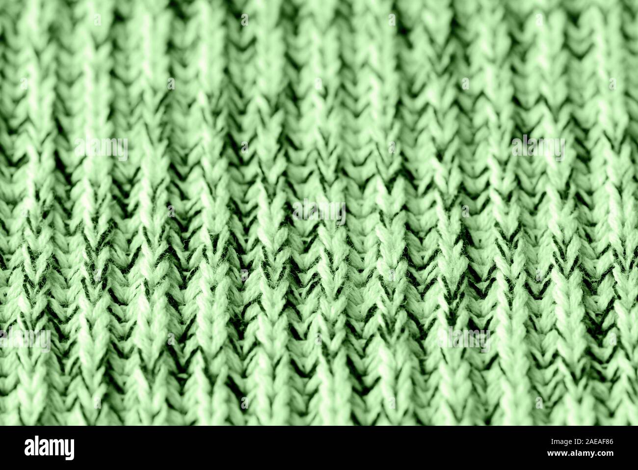 Knitted woolen texture close up. Textile background green color toned Stock Photo - Alamy