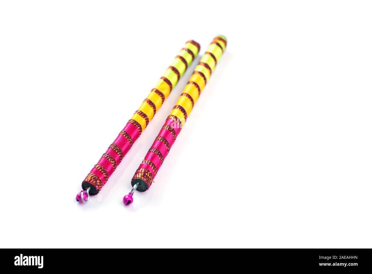 Dandiya sticks on a white background. Raas Garba or Dandiya Raas is the ...