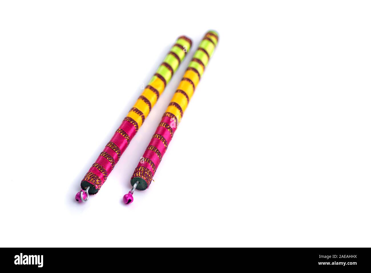 Dandiya sticks on a white background. Raas Garba or Dandiya Raas is the ...