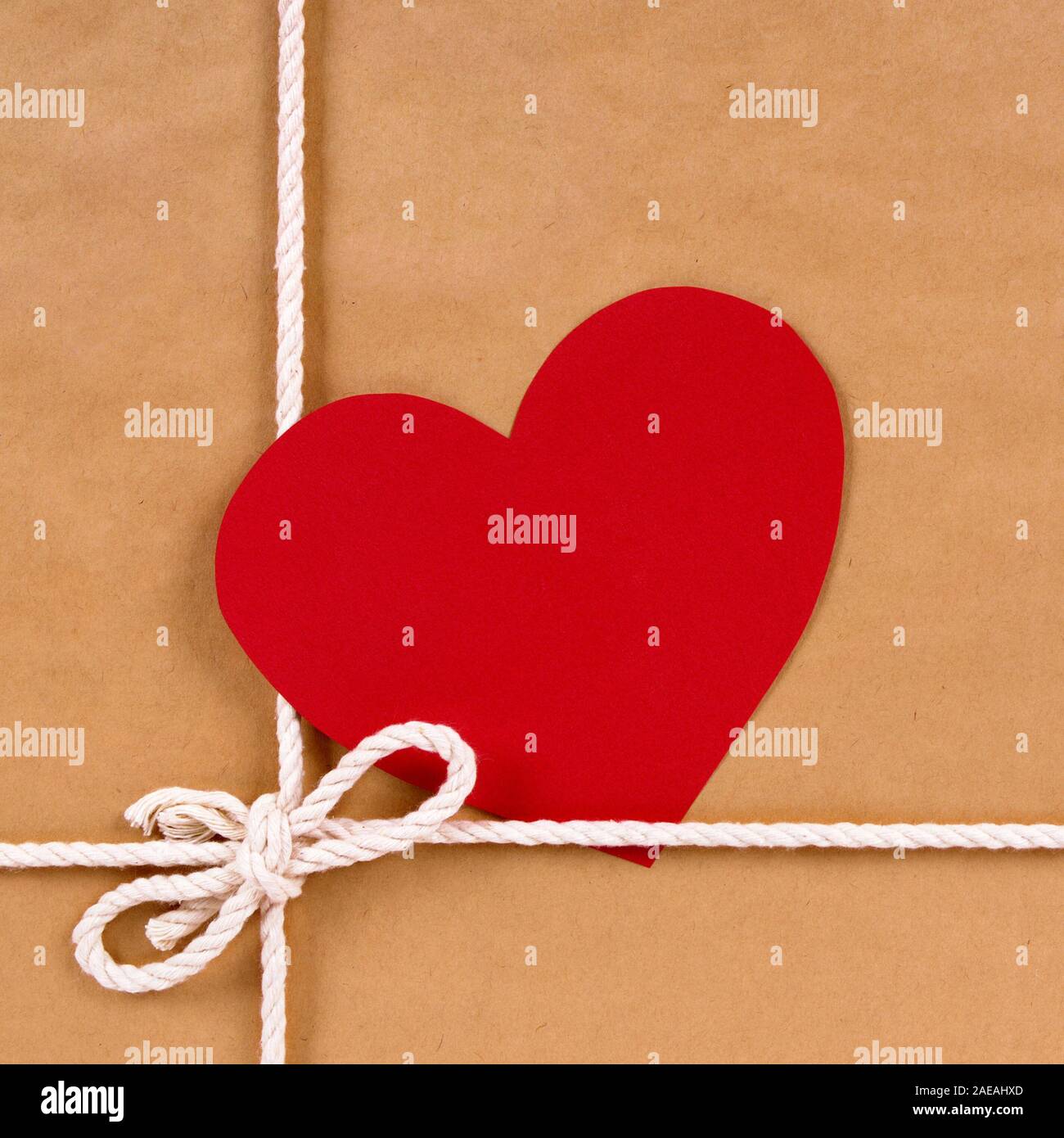 Valentine gift with gift tag, brown paper package parcel background ...