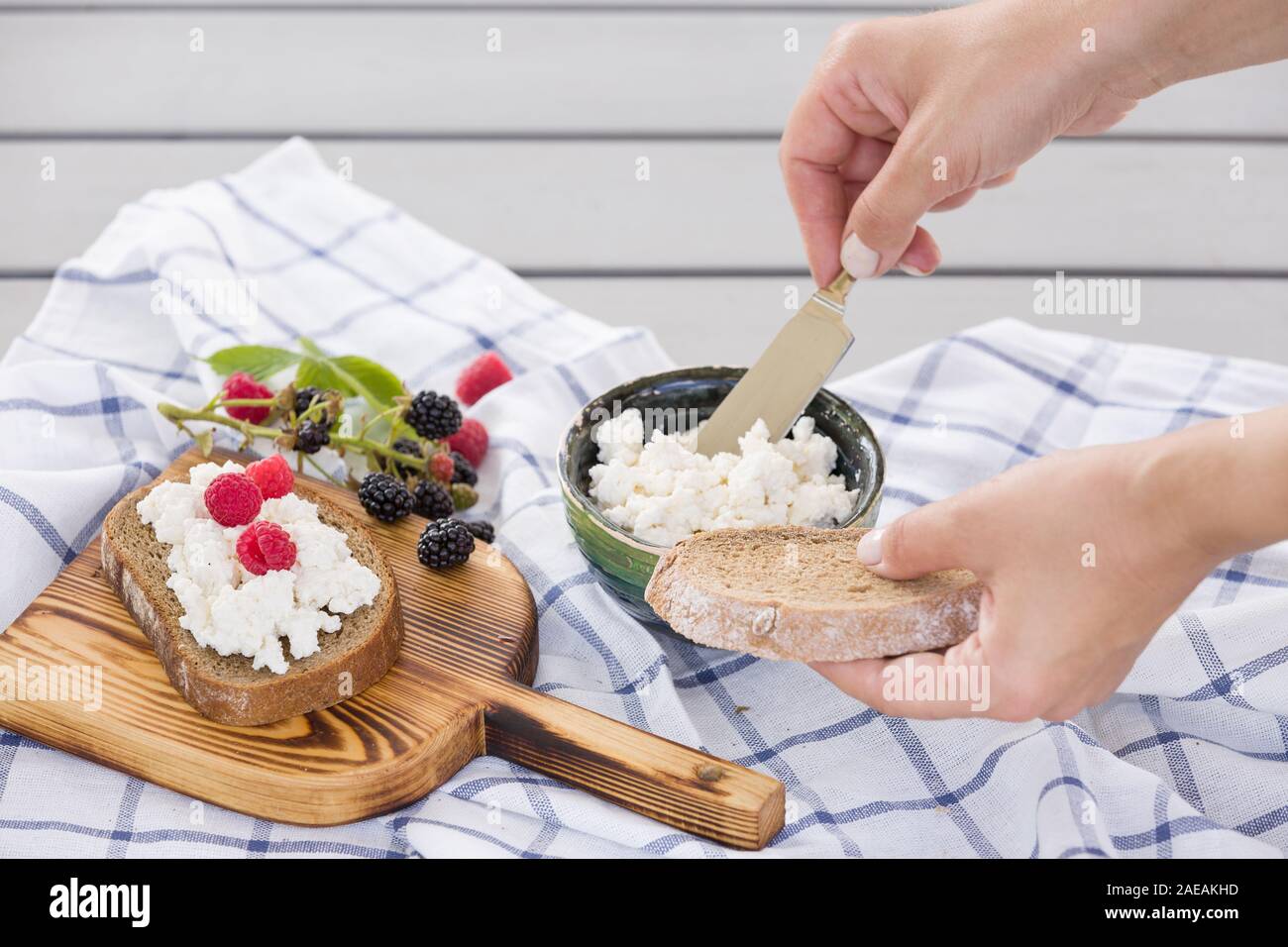 Woman taking cottage cheese from hi-res stock photography and images ...