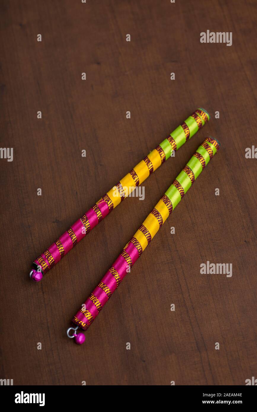 Dandiya sticks on a brown background. Raas Garba or Dandiya Raas is the ...