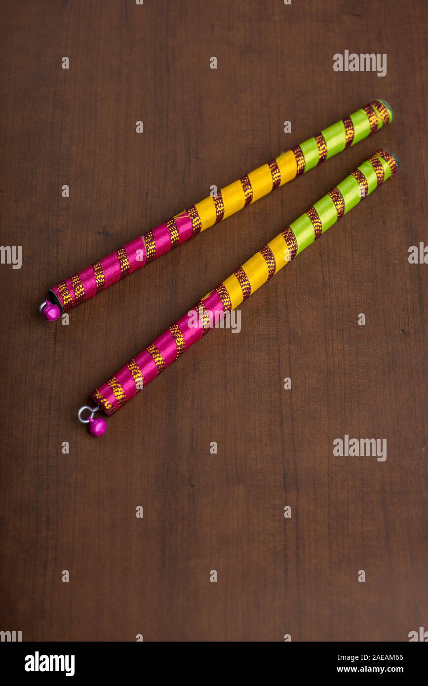 Dandiya sticks on a brown background. Raas Garba or Dandiya Raas is the ...
