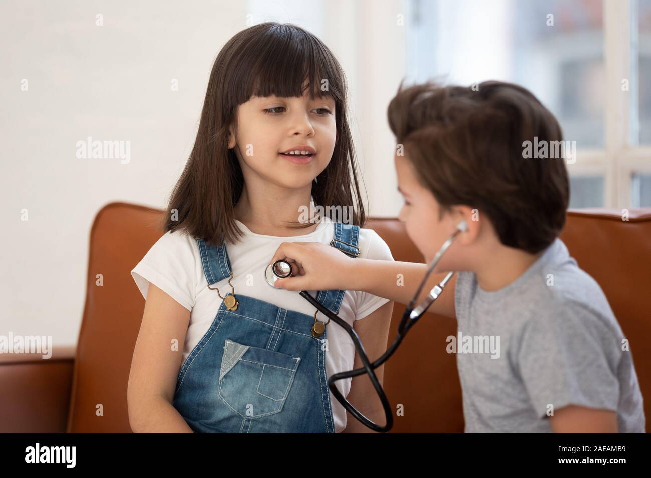 Brother sister playing doctor stethoscope hi-res stock photography and ...