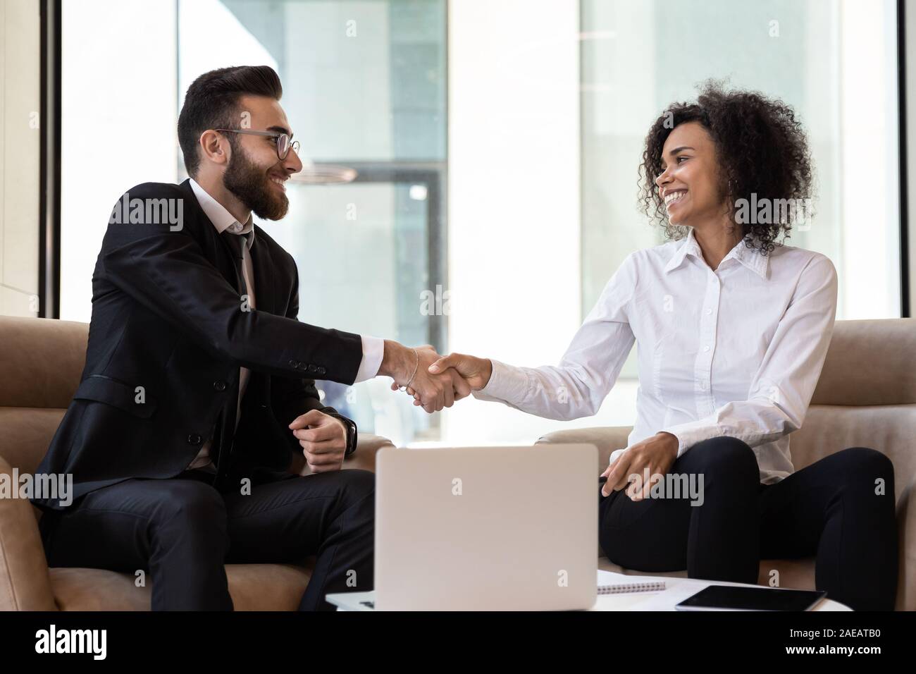 Multiracial business partners handshake get acquainted at meeting Stock ...