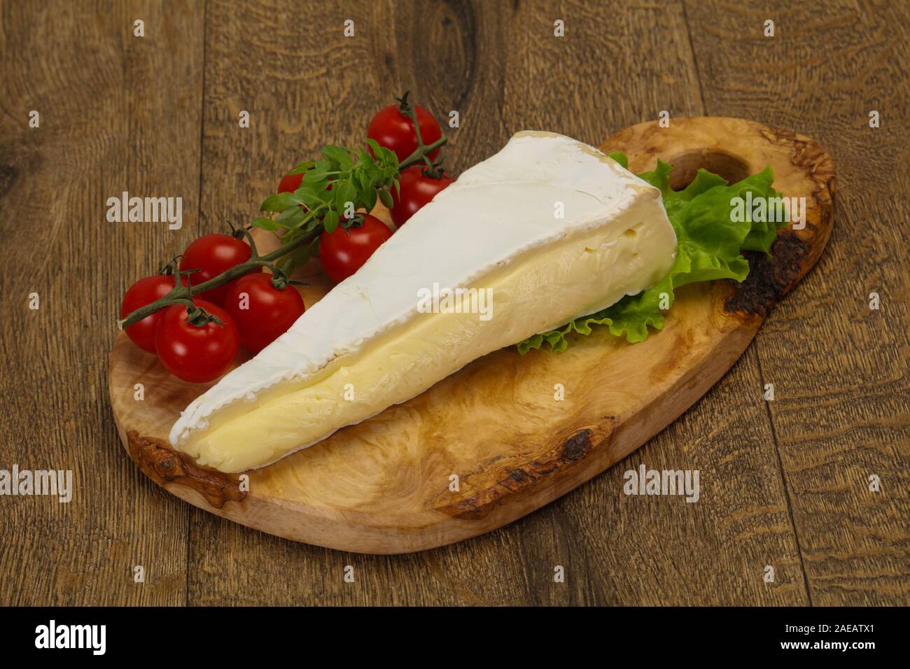 Brie cheese triangle served salad leaves Stock Photo - Alamy