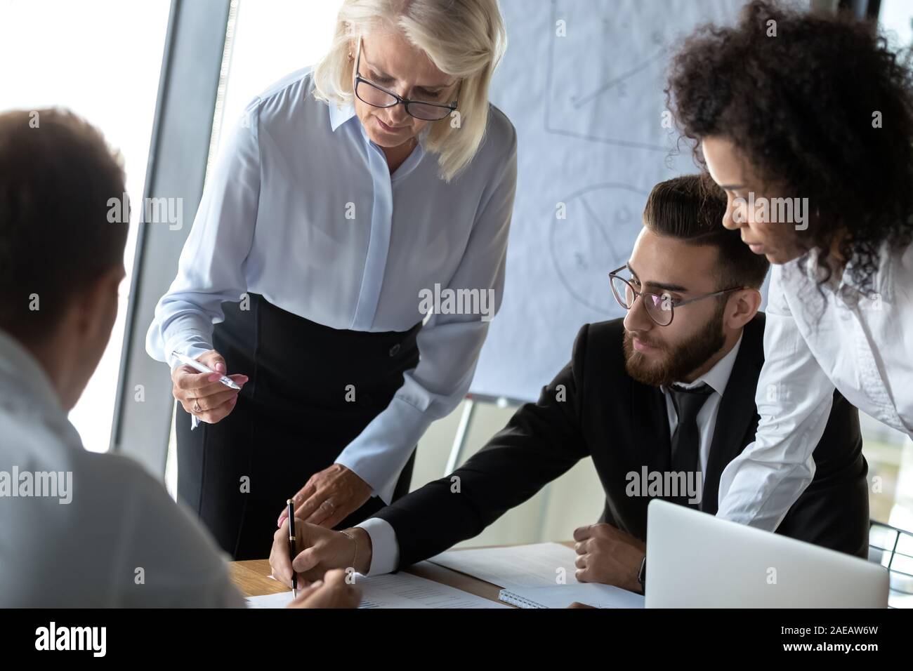 Multiracial colleagues brainstorm cooperating hi-res stock photography ...
