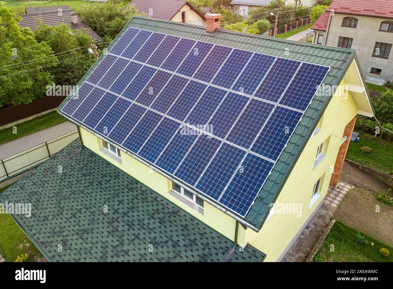 Aerial top view of new modern residential house cottage with blue shiny ...