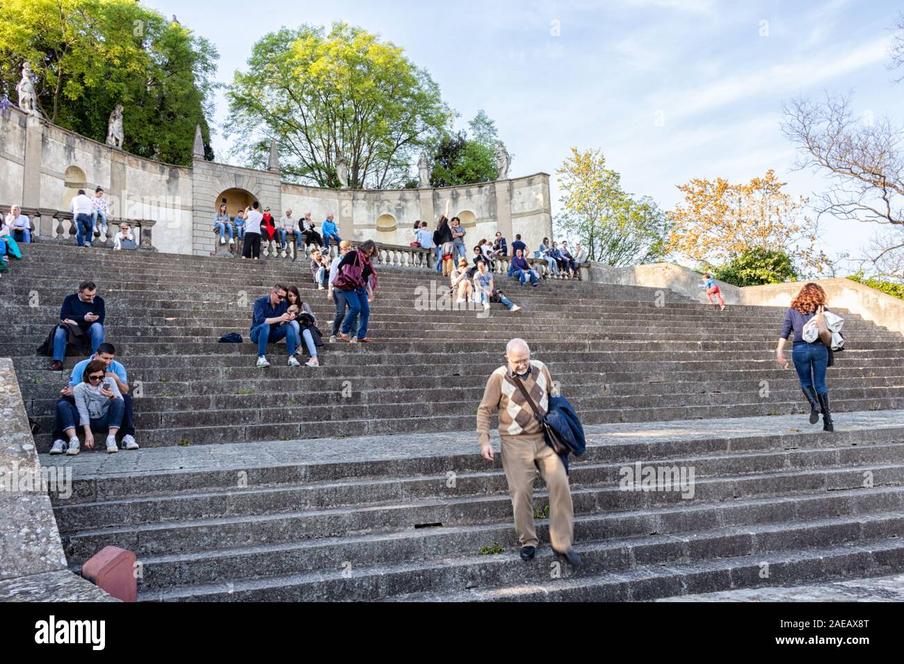Crowd people sitting on steps hi-res stock photography and images - Alamy