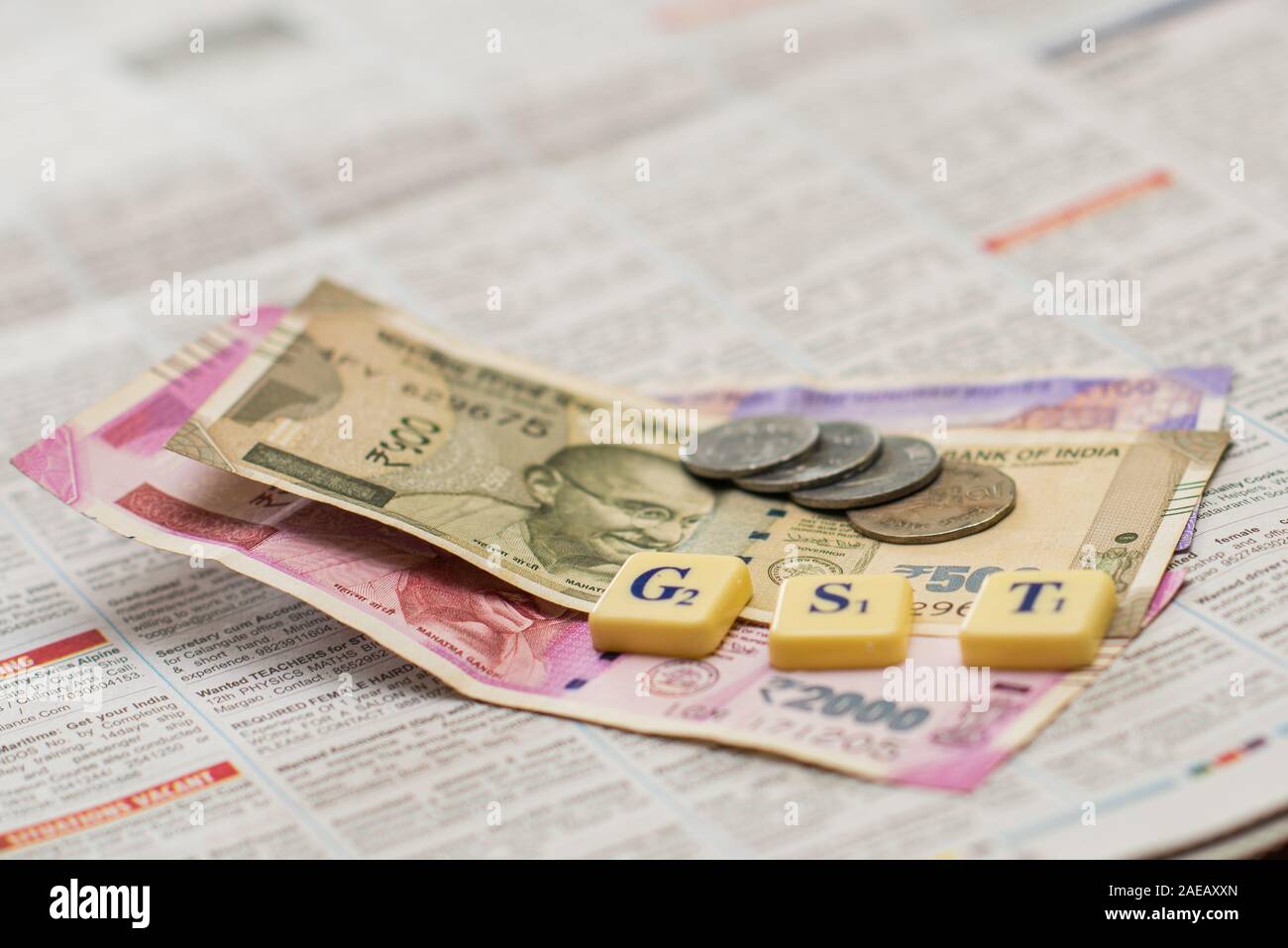 GST and TAX spelt out usingscrabble and indian currency and notes Stock ...