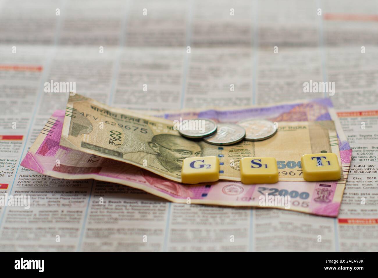 GST and TAX spelt out usingscrabble and indian currency and notes Stock ...