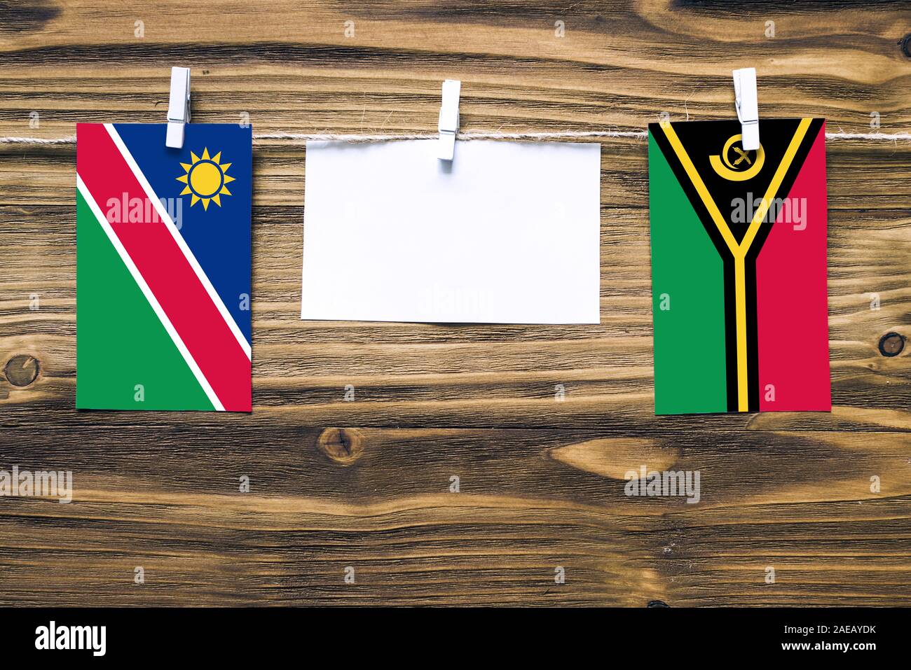 Hanging flags of Namibia and Vanuatu attached to rope with clothes pins ...