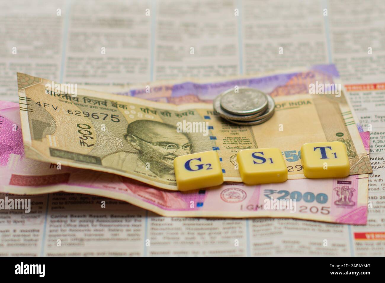GST and TAX spelt out usingscrabble and indian currency and notes Stock ...