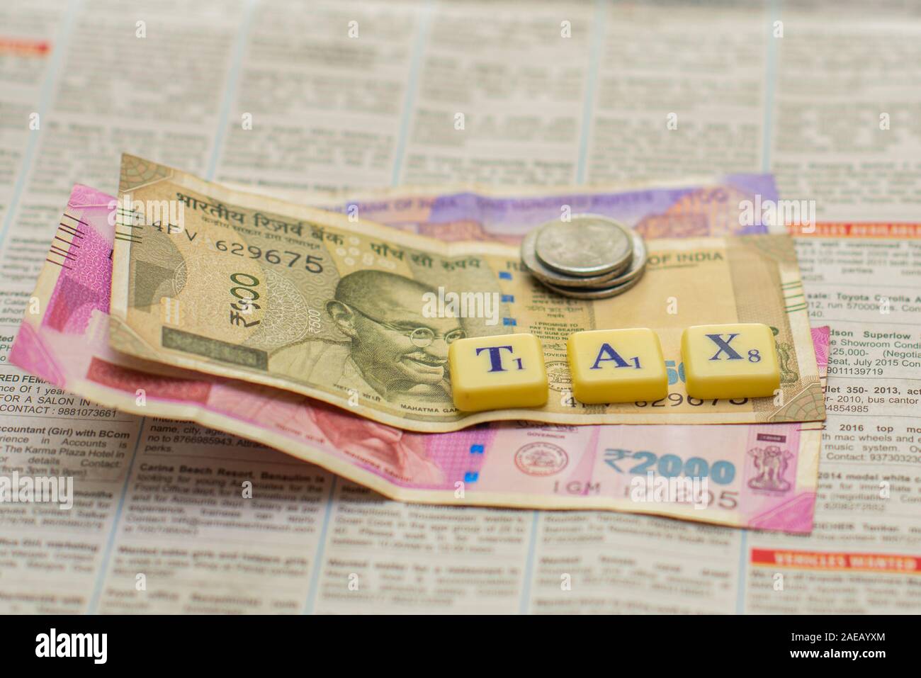 GST and TAX spelt out usingscrabble and indian currency and notes Stock ...