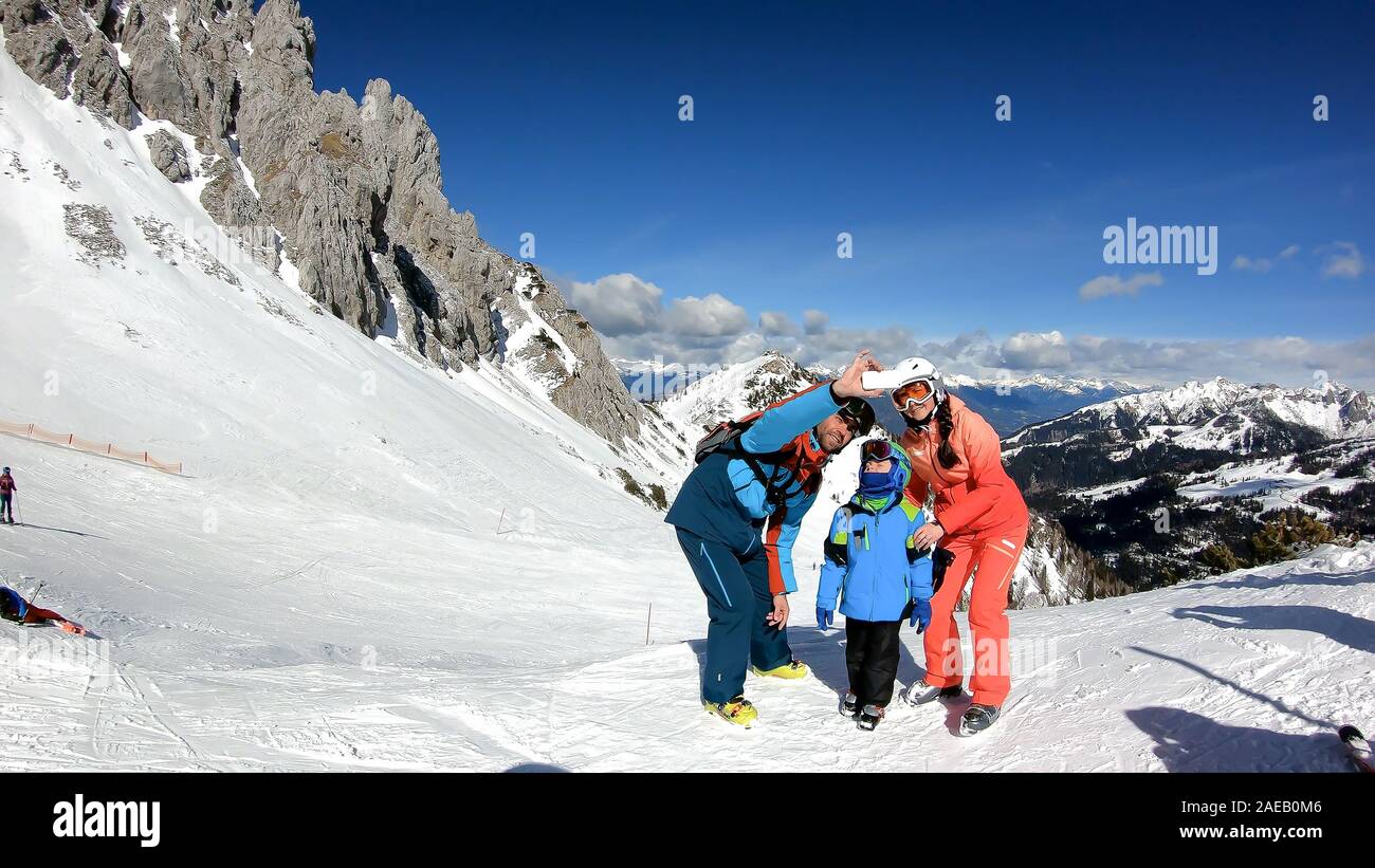 Little boy skiing in the Alpine resort. A 6 year old child enjoys a ...