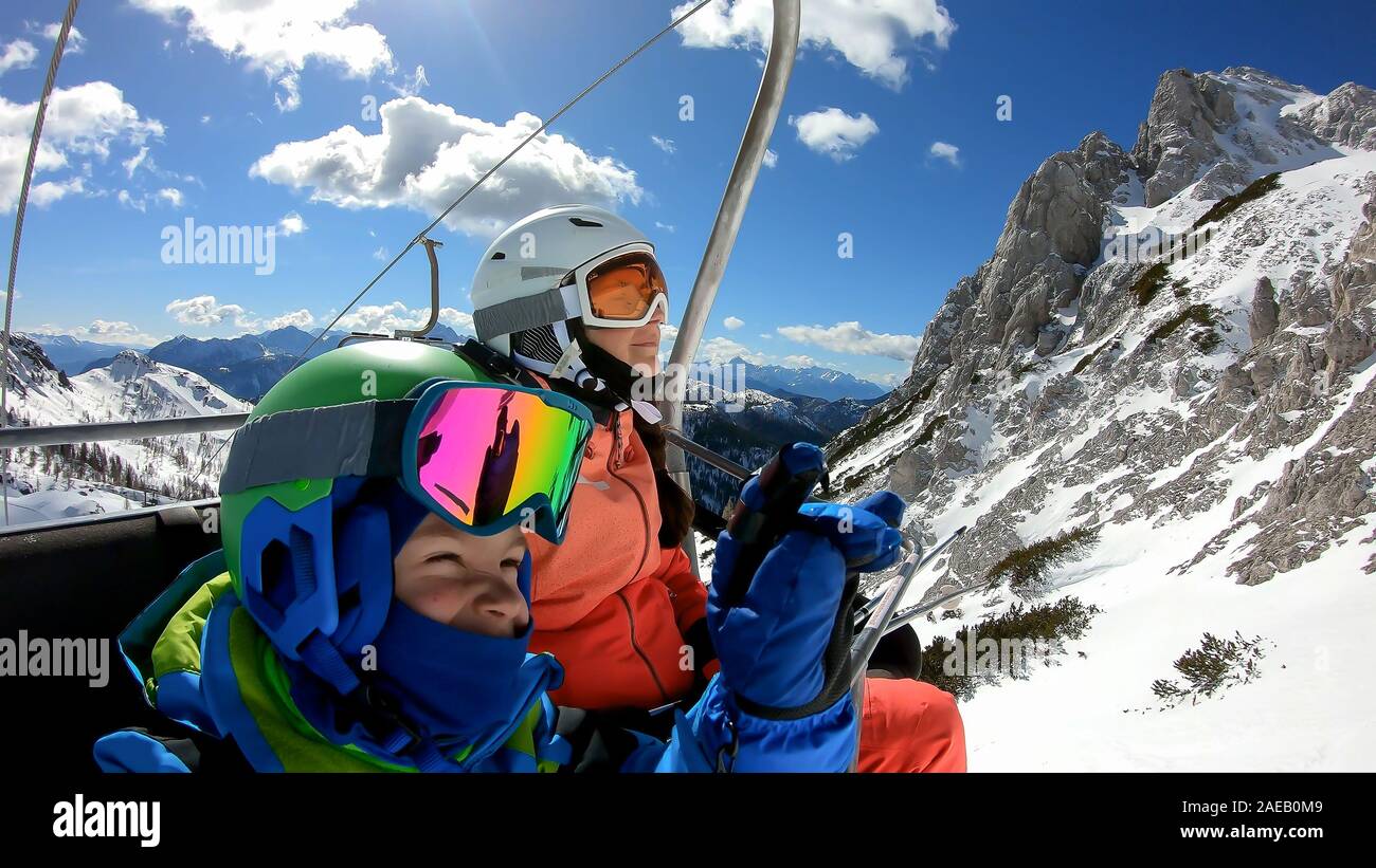 Little boy skiing in the Alpine resort. A 6 year old child enjoys a ...