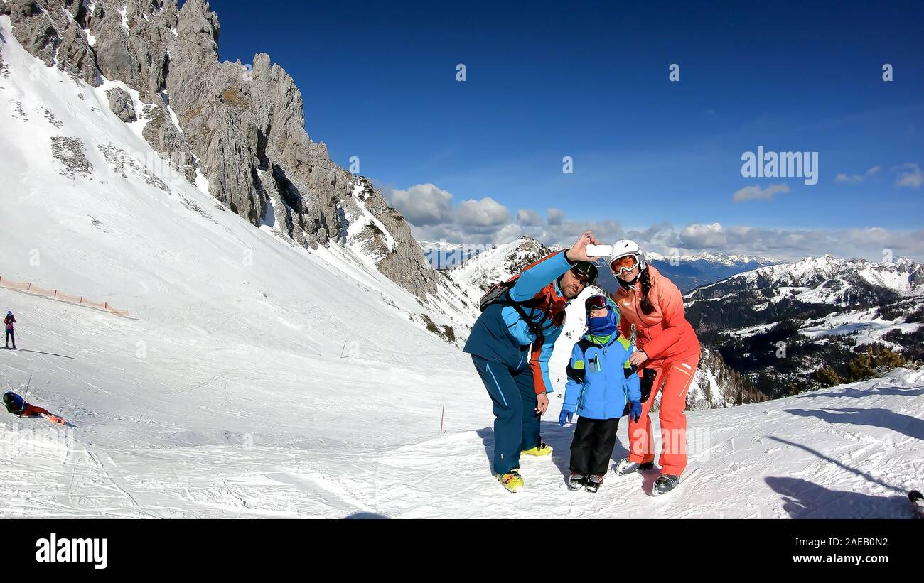 Little boy skiing in the Alpine resort. A 6 year old child enjoys a ...