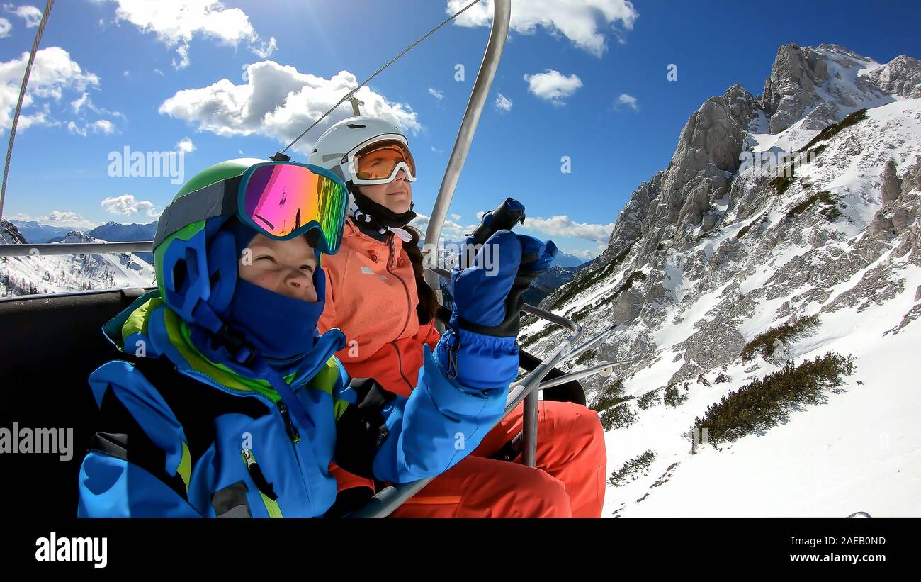 Little boy skiing in the Alpine resort. A 6 year old child enjoys a ...